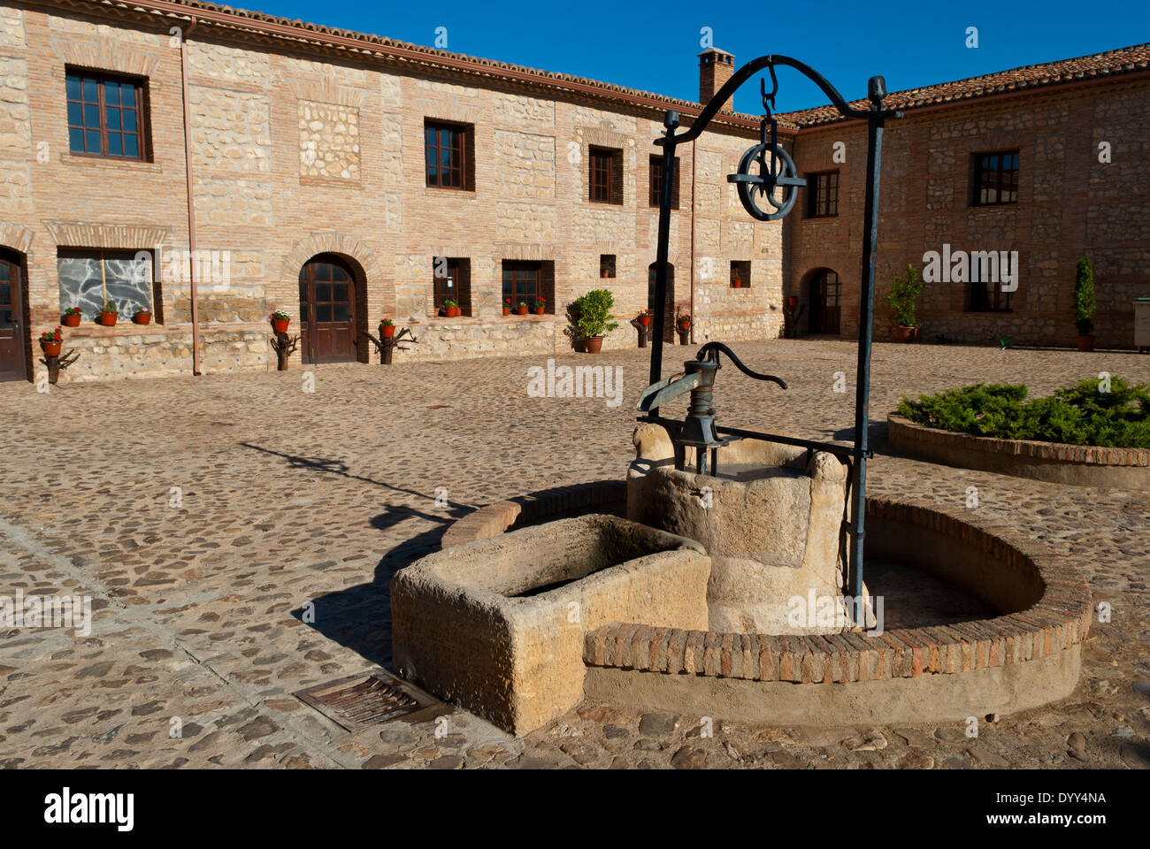 Water well in the square stone of the chapel Stock Photo - Alamy