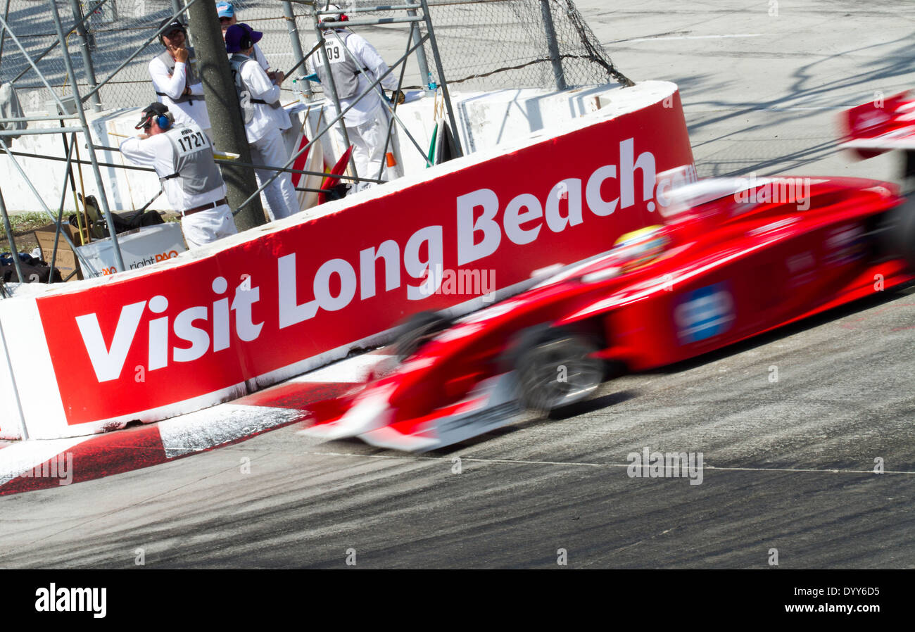 Unidentified Indy racing car streaks by the "visit Long Beach" sign at ...