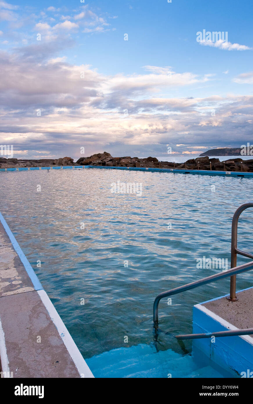 ocean tidal pool built into the natural sea rocks early sunset. calm ...