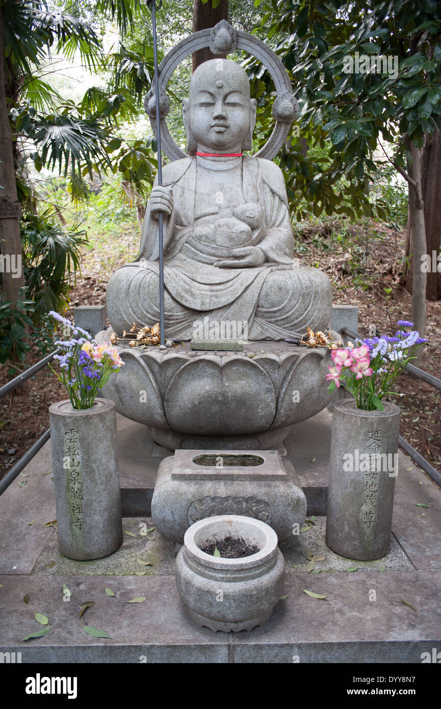 Stone statue in a temple, Tokyo, Japan Stock Photo - Alamy
