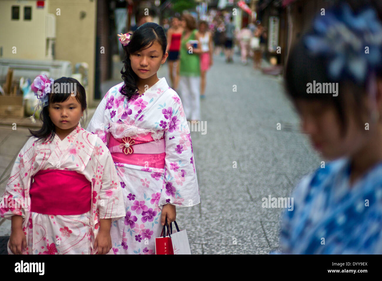 Girls wearing traditional kimonos in the temple hi-res stock ...