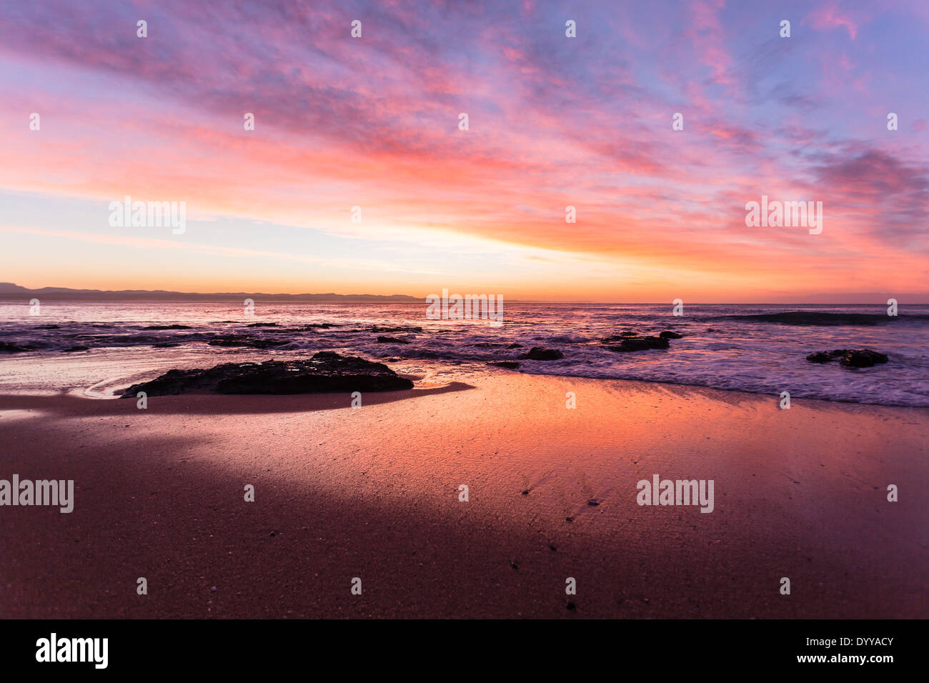 Morning dawn colors of scenic light reflections on beach ocean waters ...
