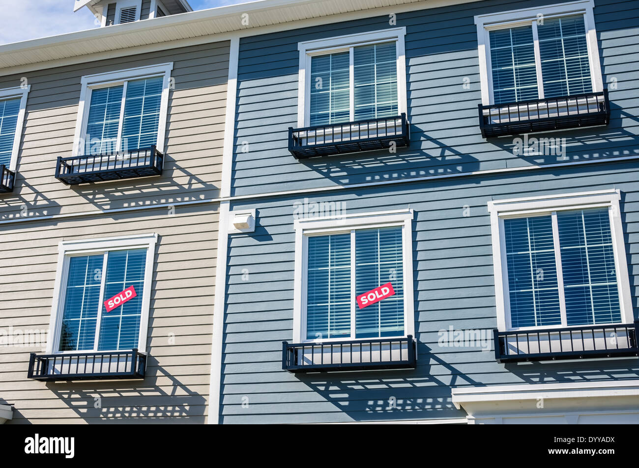 Architectural details of modern apartment building. Sign SOLD in the ...