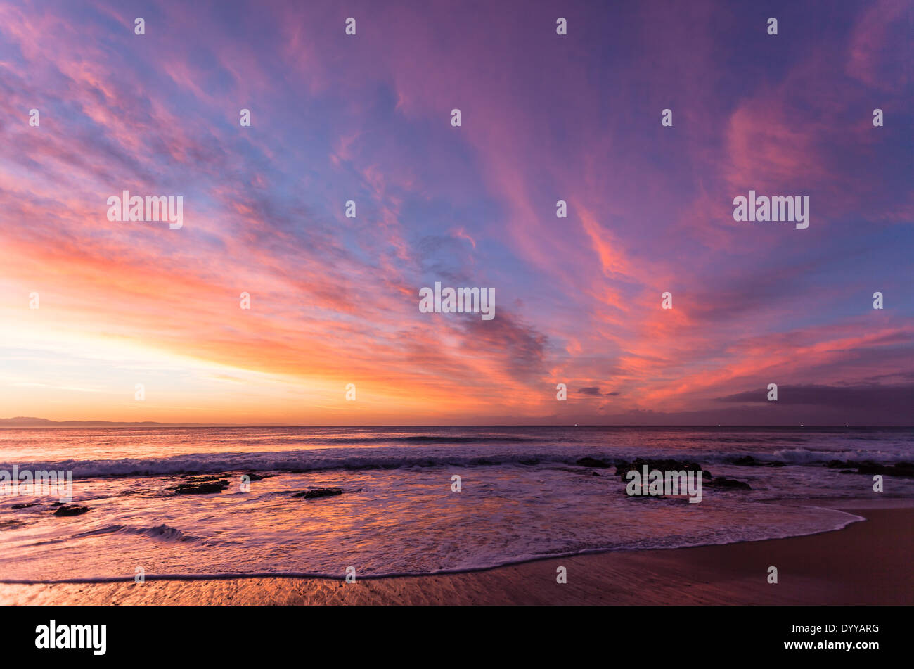 Morning dawn colors of scenic light reflections on beach ocean waters ...