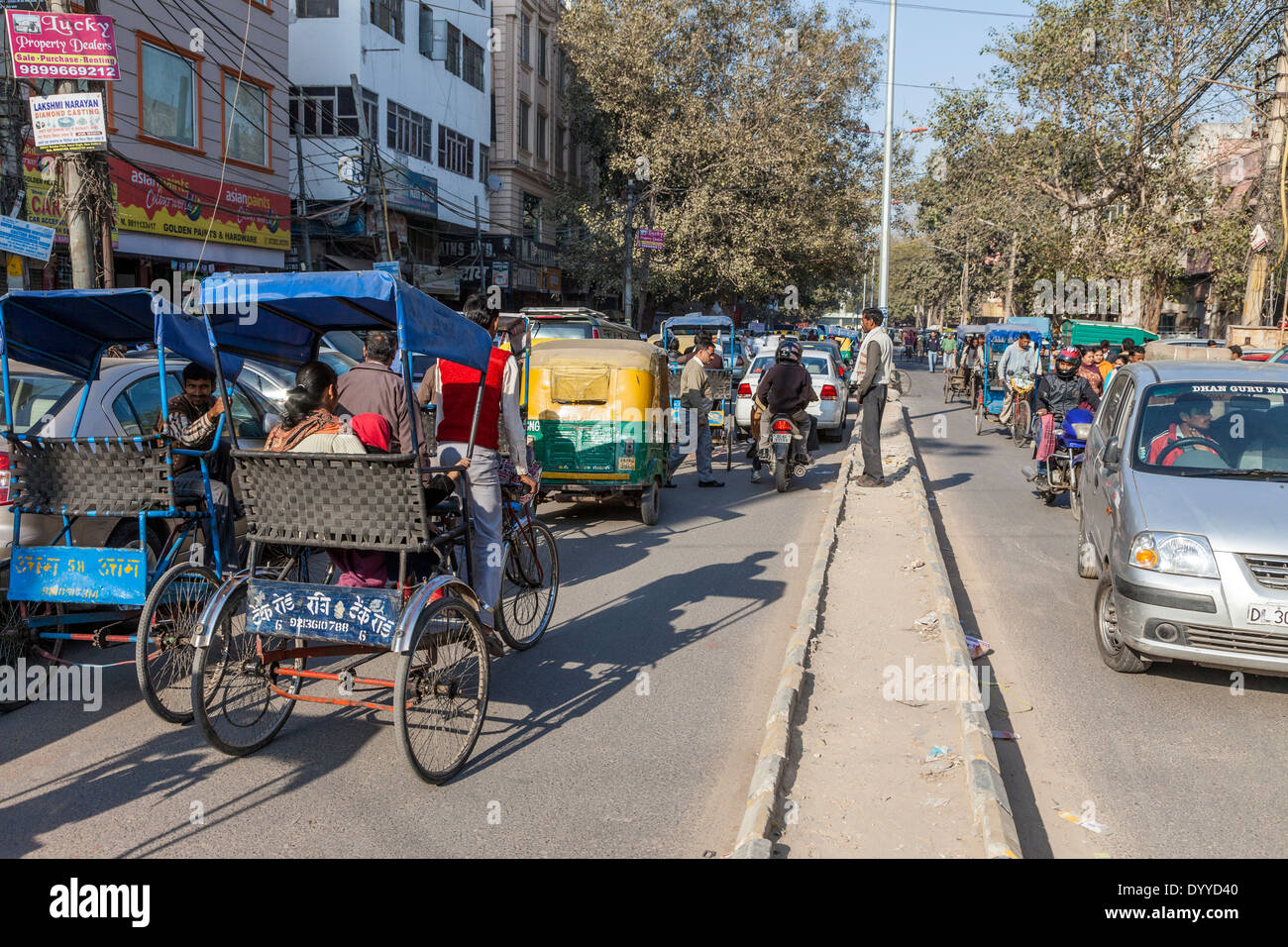 New Delhi, India. Rickshaw and Car Traffic on a Downtown Street in ...