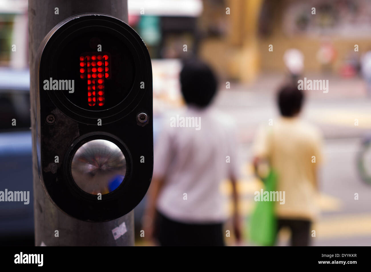 a stop sign with people crossing the road Stock Photo - Alamy