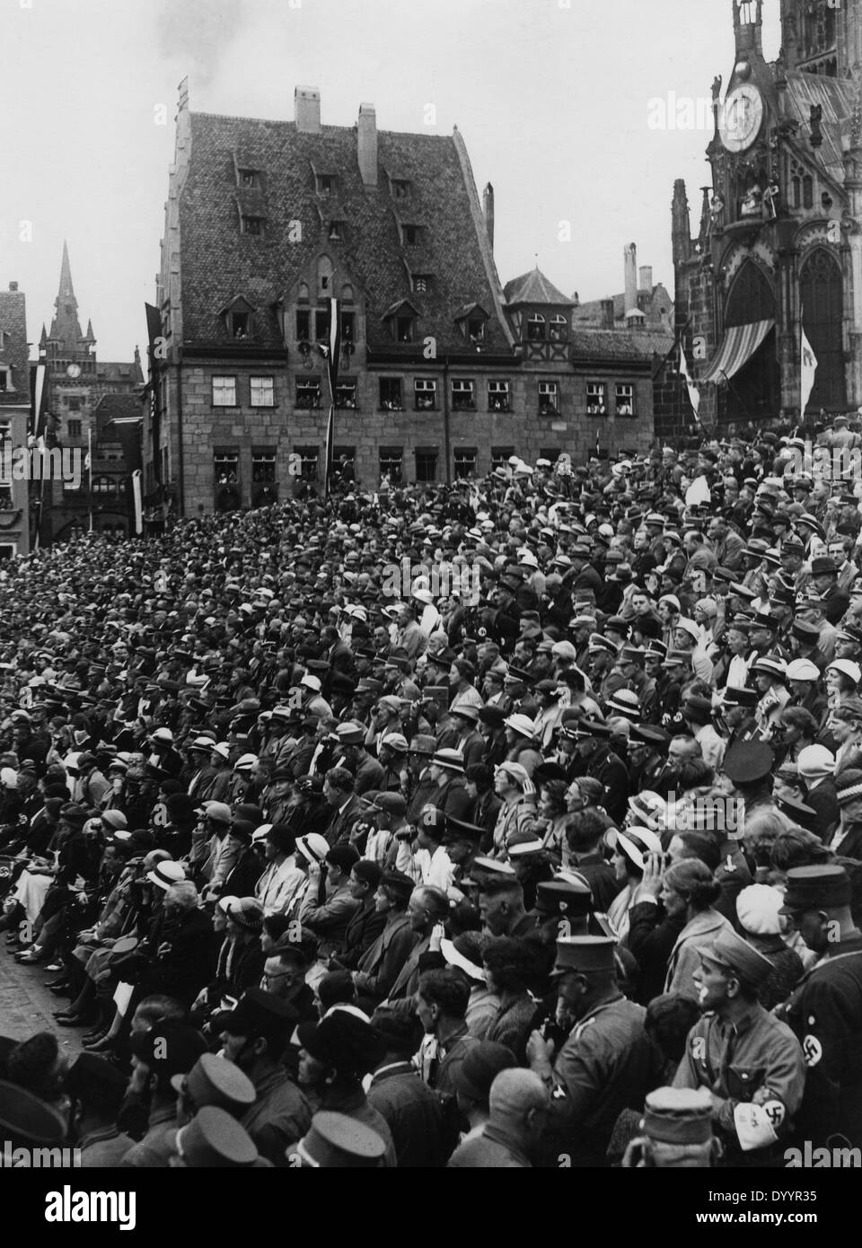 Crowd of people watches the parade during the 'Ralley of Victory', 1933 ...