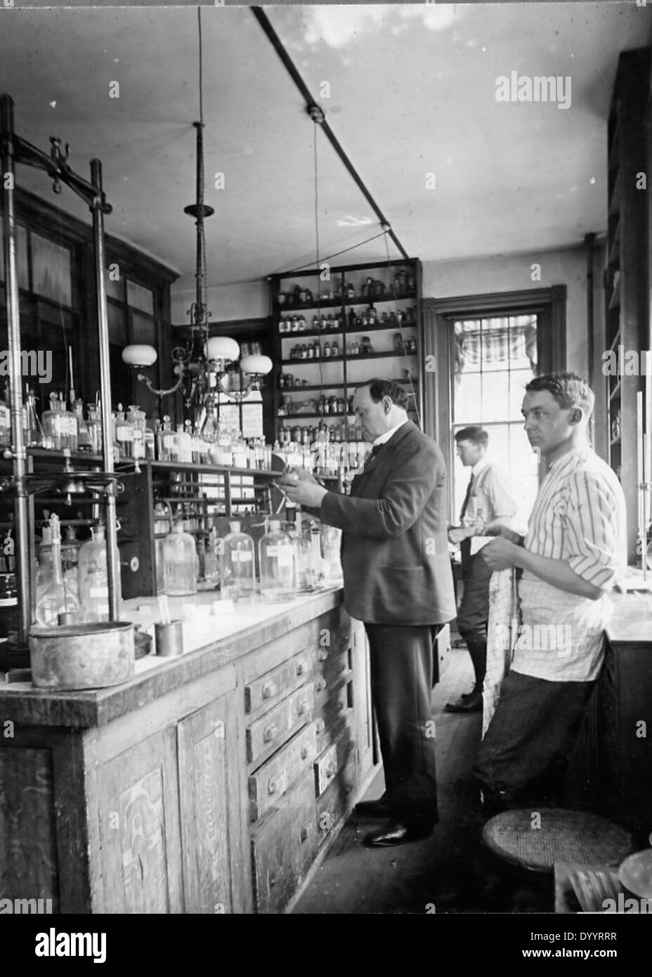 Harvey W. Wiley is pictured conducting experiments in his laboratory ...