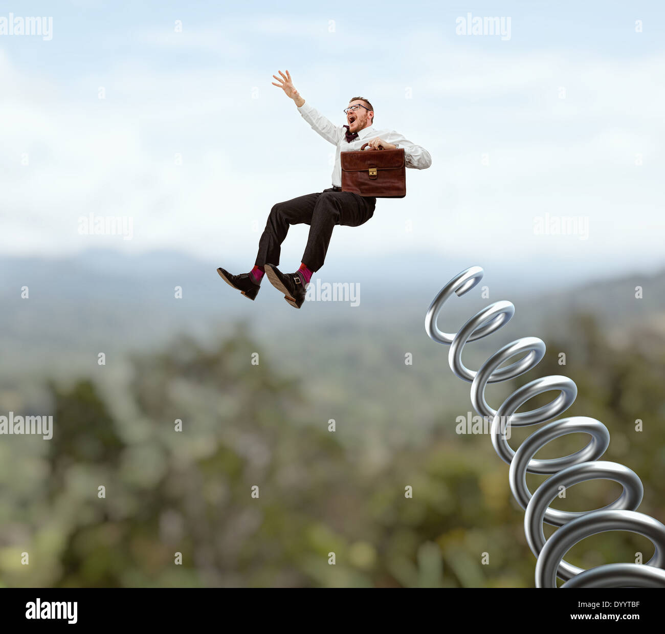 flying businessman and huge metal spring Stock Photo - Alamy