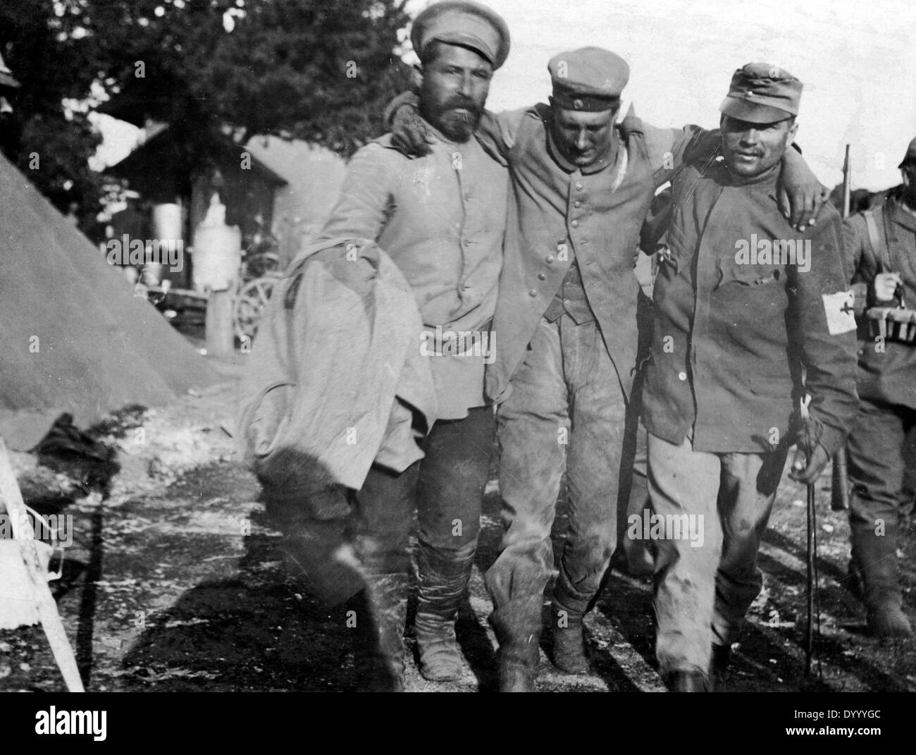 A Russian and Austrian soldier support a wounded German, 1915 Stock ...