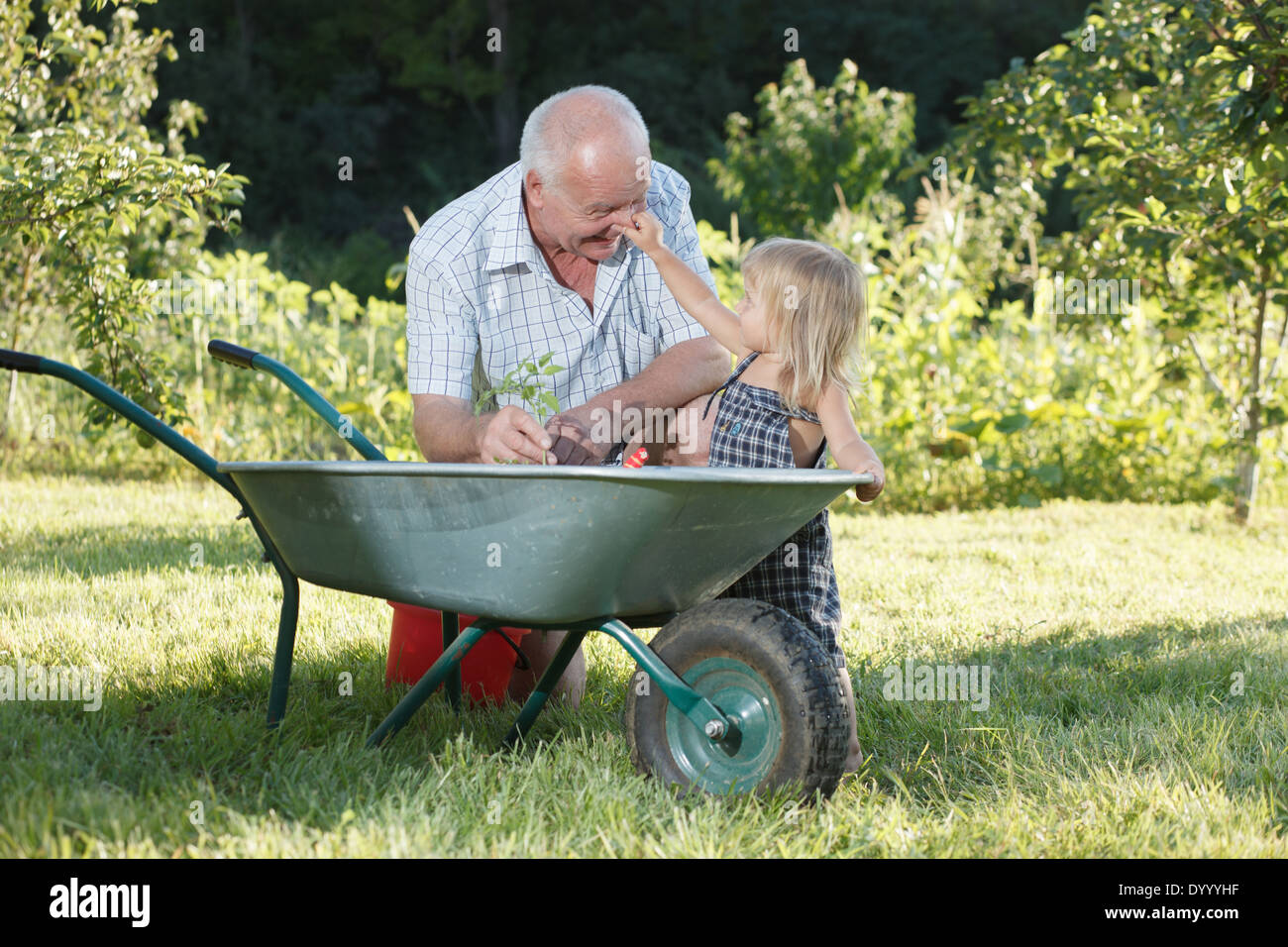 Child helping elderly hi-res stock photography and images - Alamy