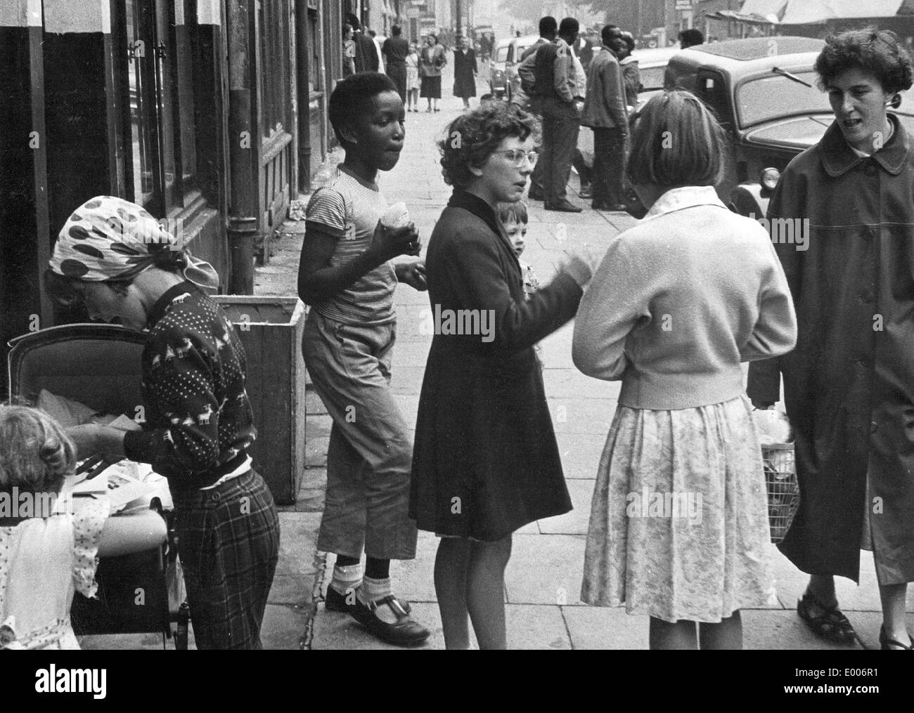 Light-and dark-skinned people in the streets of London, 1958 Stock ...