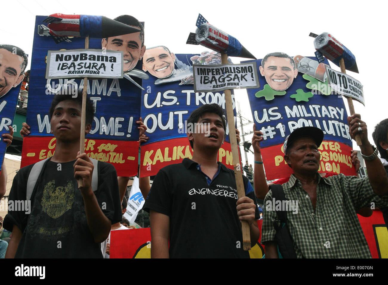 Manila, Philippines. 28th April, 2014. Protesters holding missiles made ...