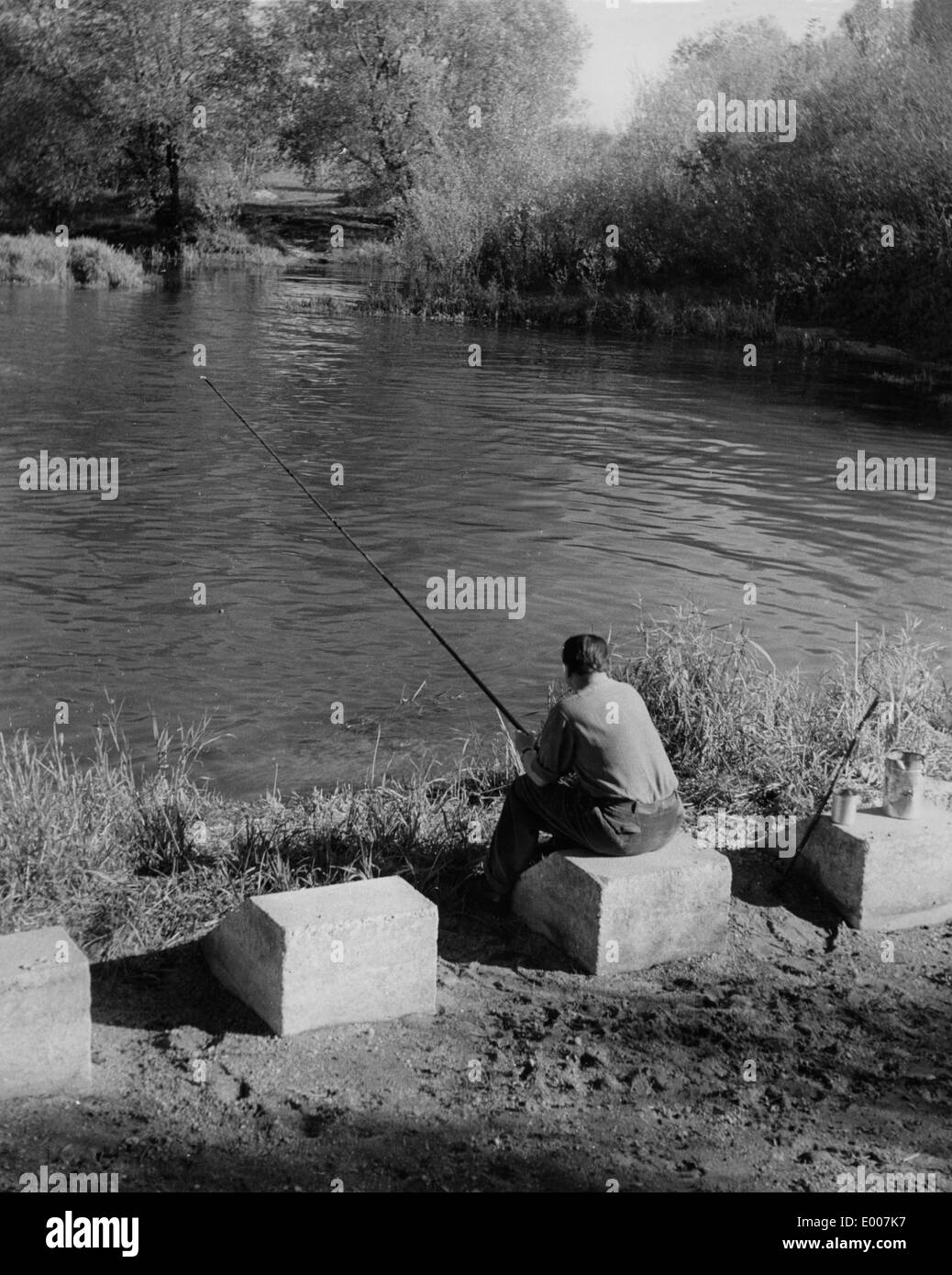 Angler sitting Black and White Stock Photos & Images - Alamy