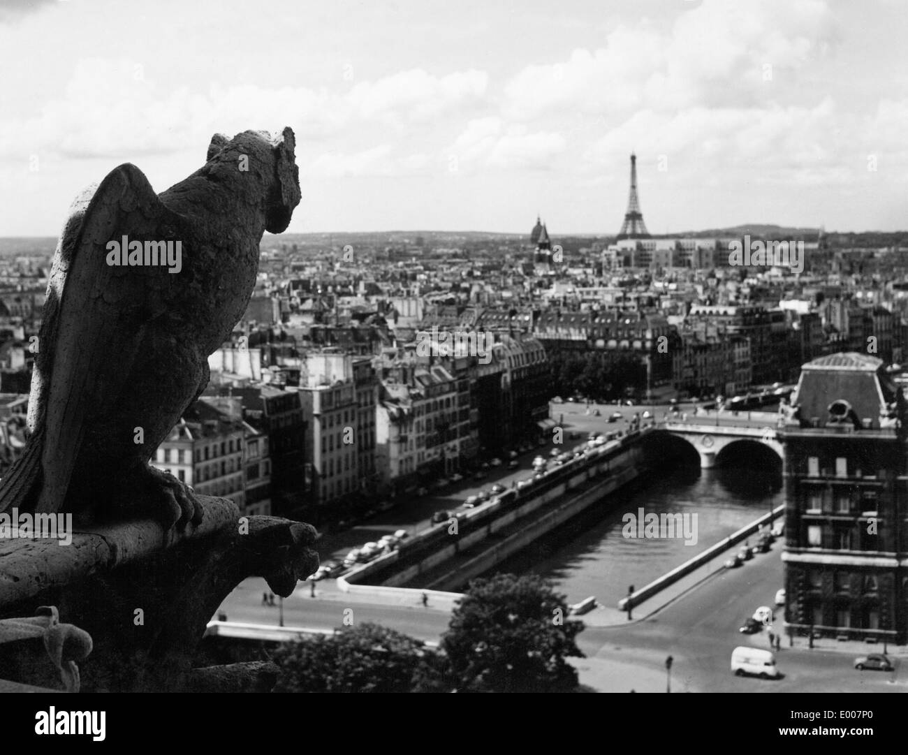 A gargoyle on the Notre Dame Cathedral overlooking Paris, 1959 Stock ...