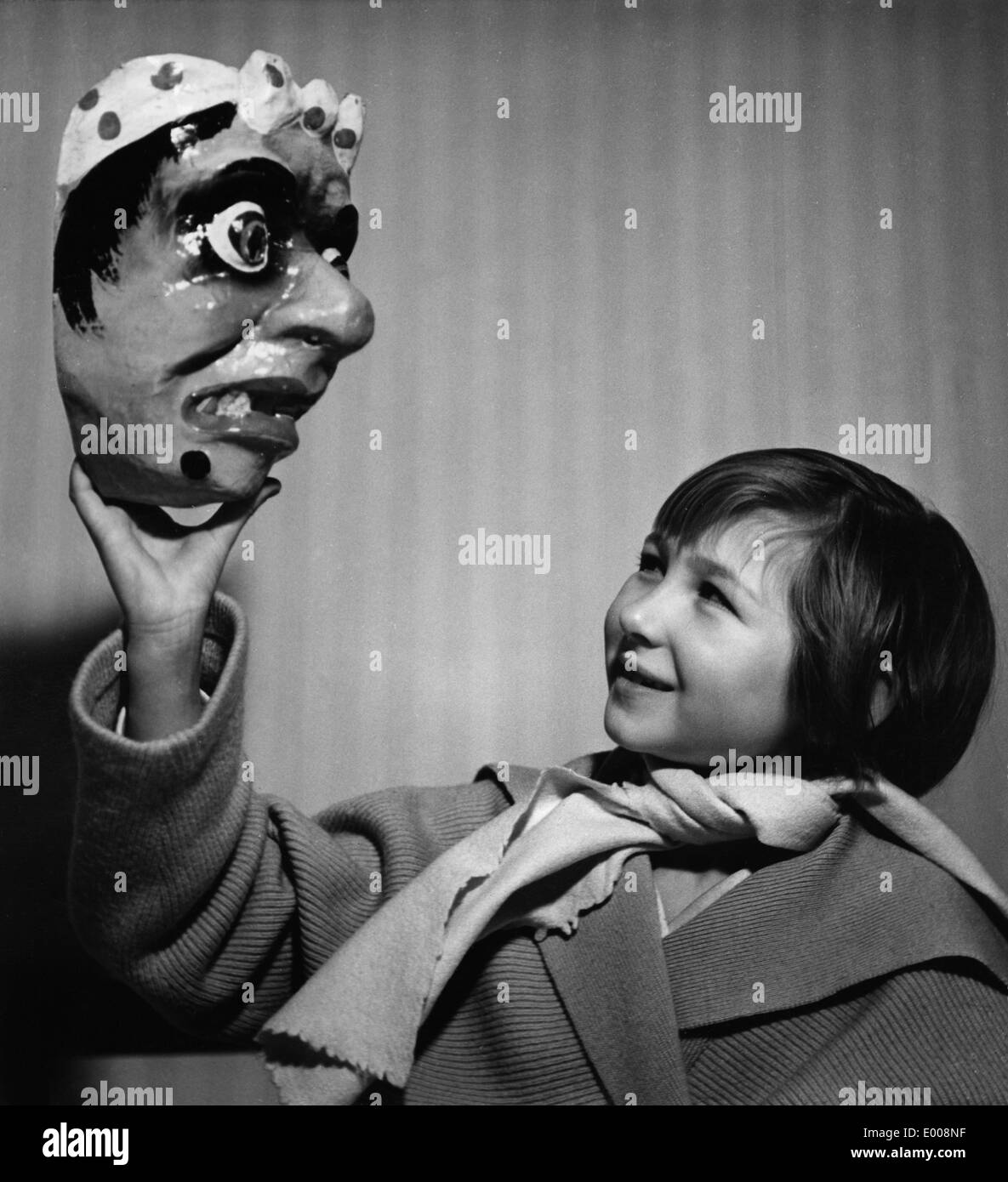 A girl with a carnival mask, 50s Stock Photo - Alamy