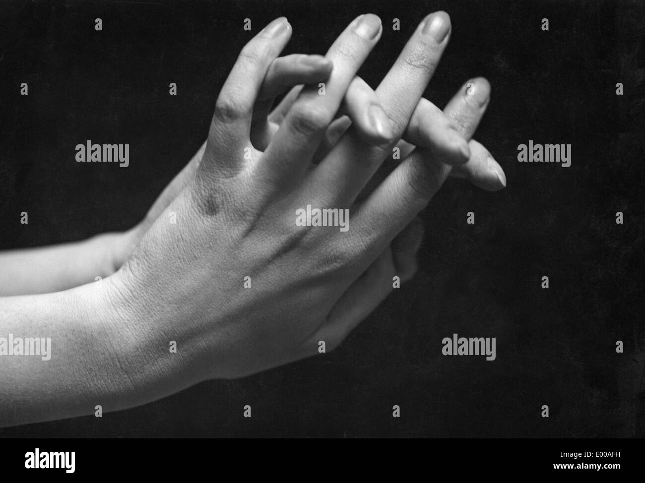 Entangled hands of a woman hi-res stock photography and images - Alamy