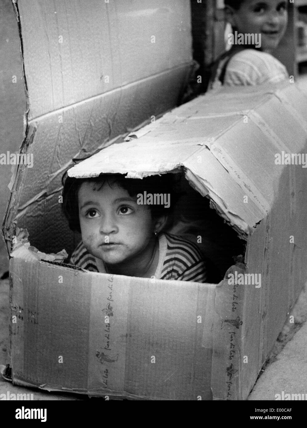 Boy in a box Black and White Stock Photos & Images - Alamy