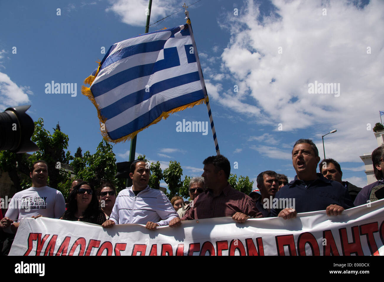 Athens, Greece. 28th Apr, 2014. Demonstrators stand in front of the ...
