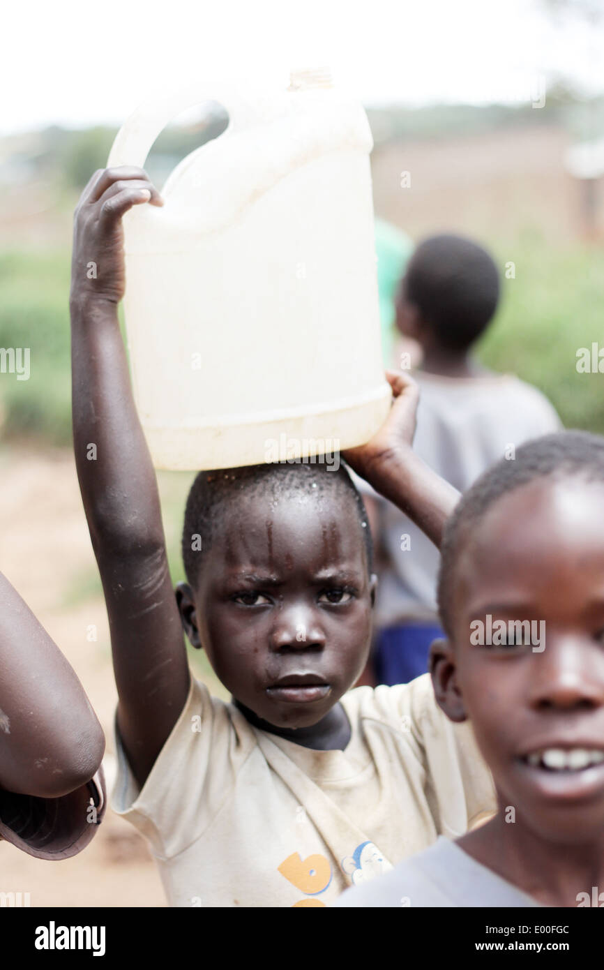 Children collect water from an unclean government water source in the ...