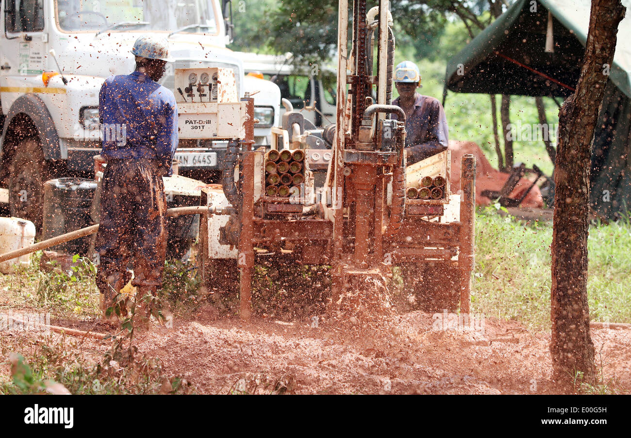 An NGO funded drilling team drill a cleaning drinking water well at a ...