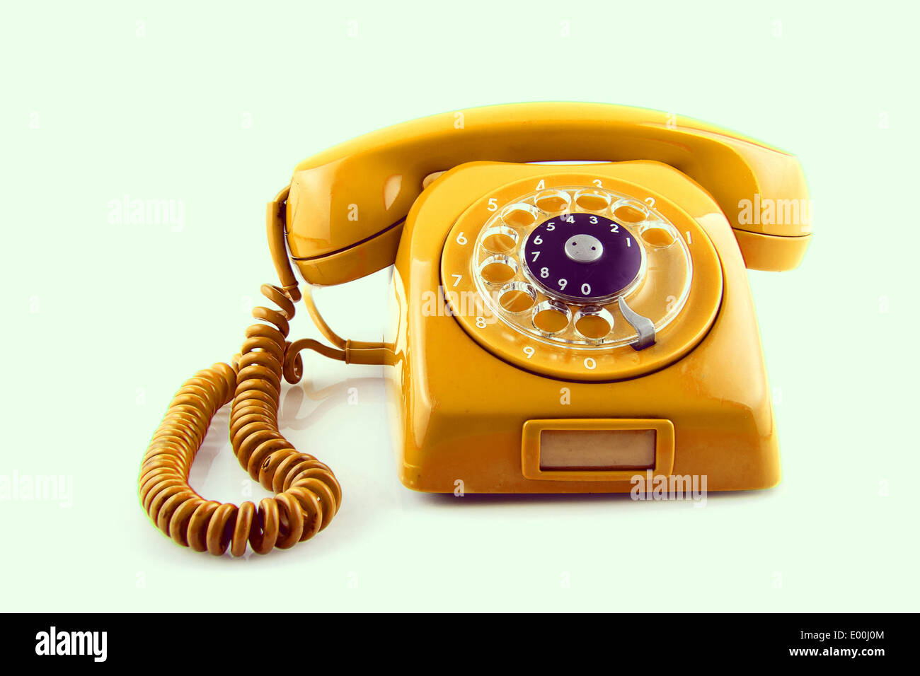 old Orange telephone with rotary dial Stock Photo - Alamy