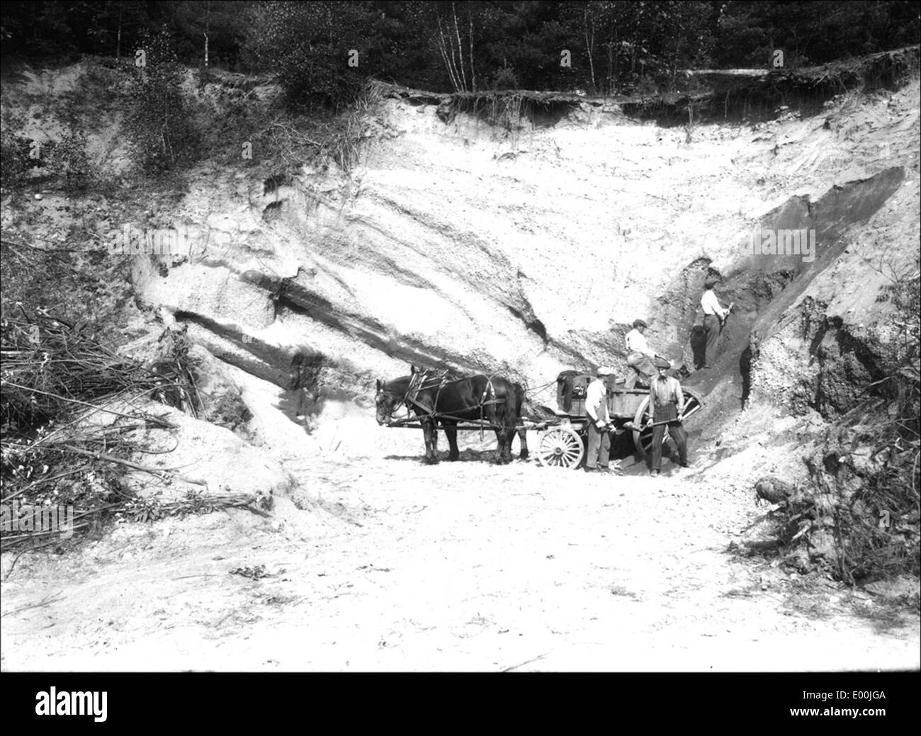 This historical photograph by Bion Whitehouse depicts workers ...