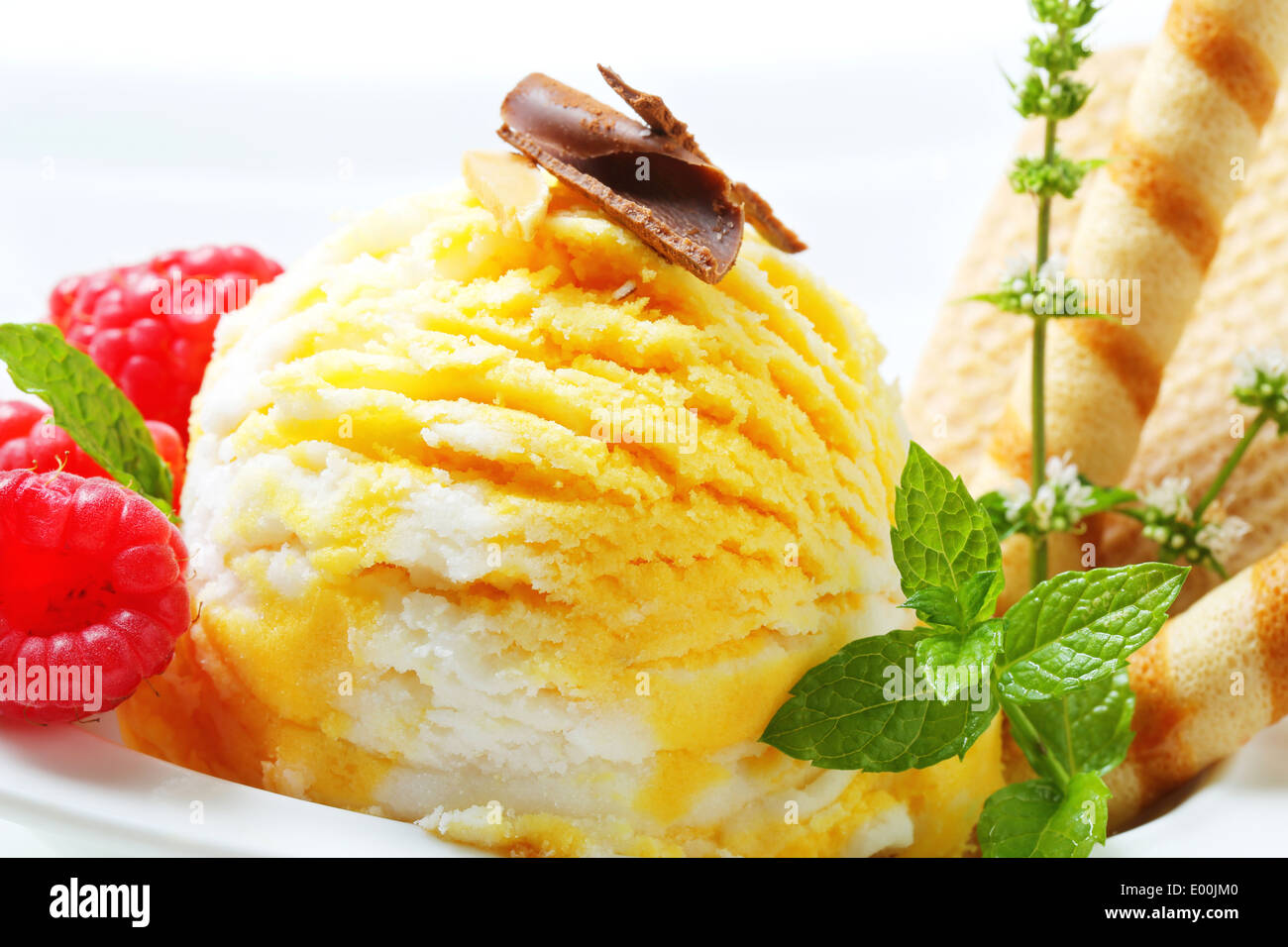 Scoop of ice cream with wafer sticks and raspberries Stock Photo - Alamy