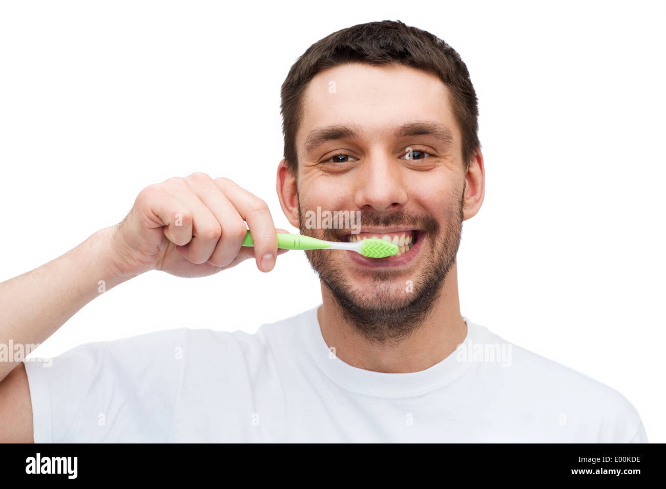 smiling young man with toothbrush Stock Photo - Alamy