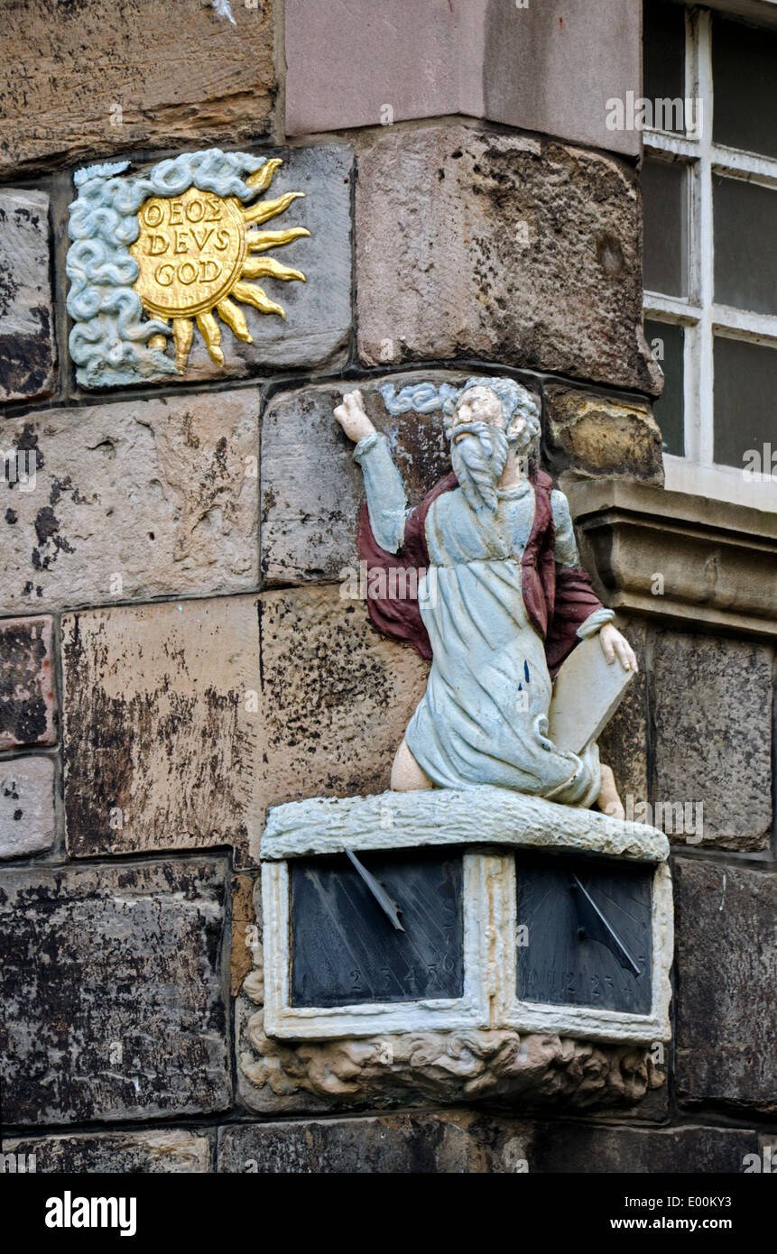 Moses depicted pointing to the sun on a sundial on the corner of John ...