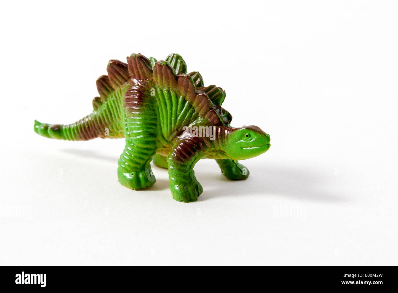 Plastic toys and figures from a play set, dinosaurs, farm animals and ...