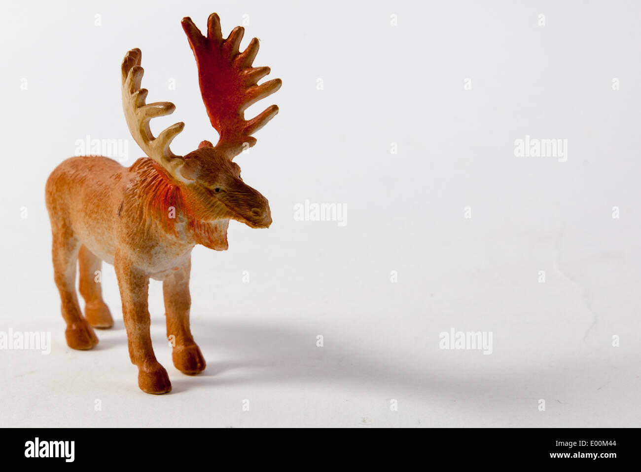 Plastic toys and figures from a play set, dinosaurs, farm animals and ...