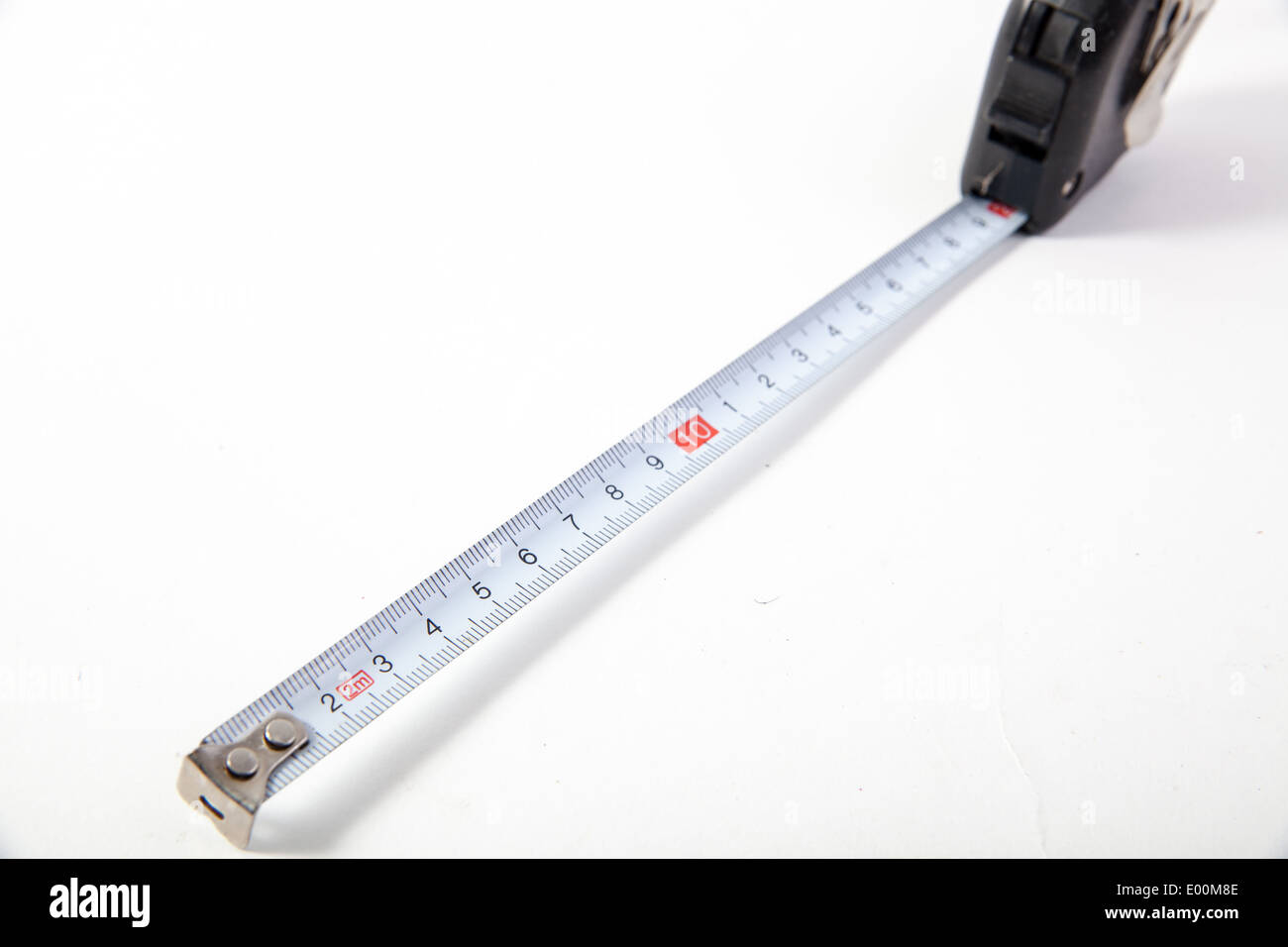Tape measure with twenty centimeters showing, on a white background ...