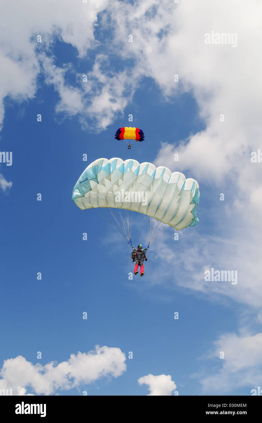 One day with parachutist in airfield. The skydiver lands under the ...