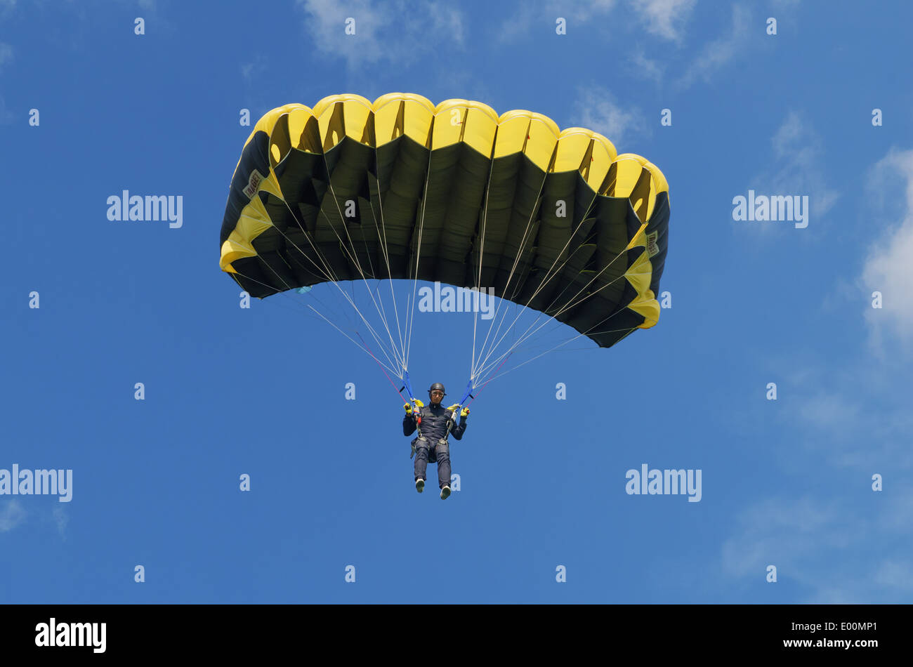 One day with parachutist in airfield. The skydiver lands under the ...
