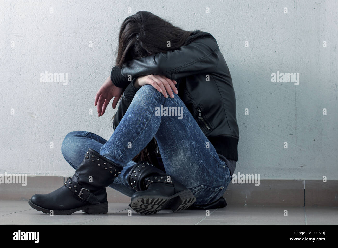 Sad teenage girl with hands over face Stock Photo - Alamy