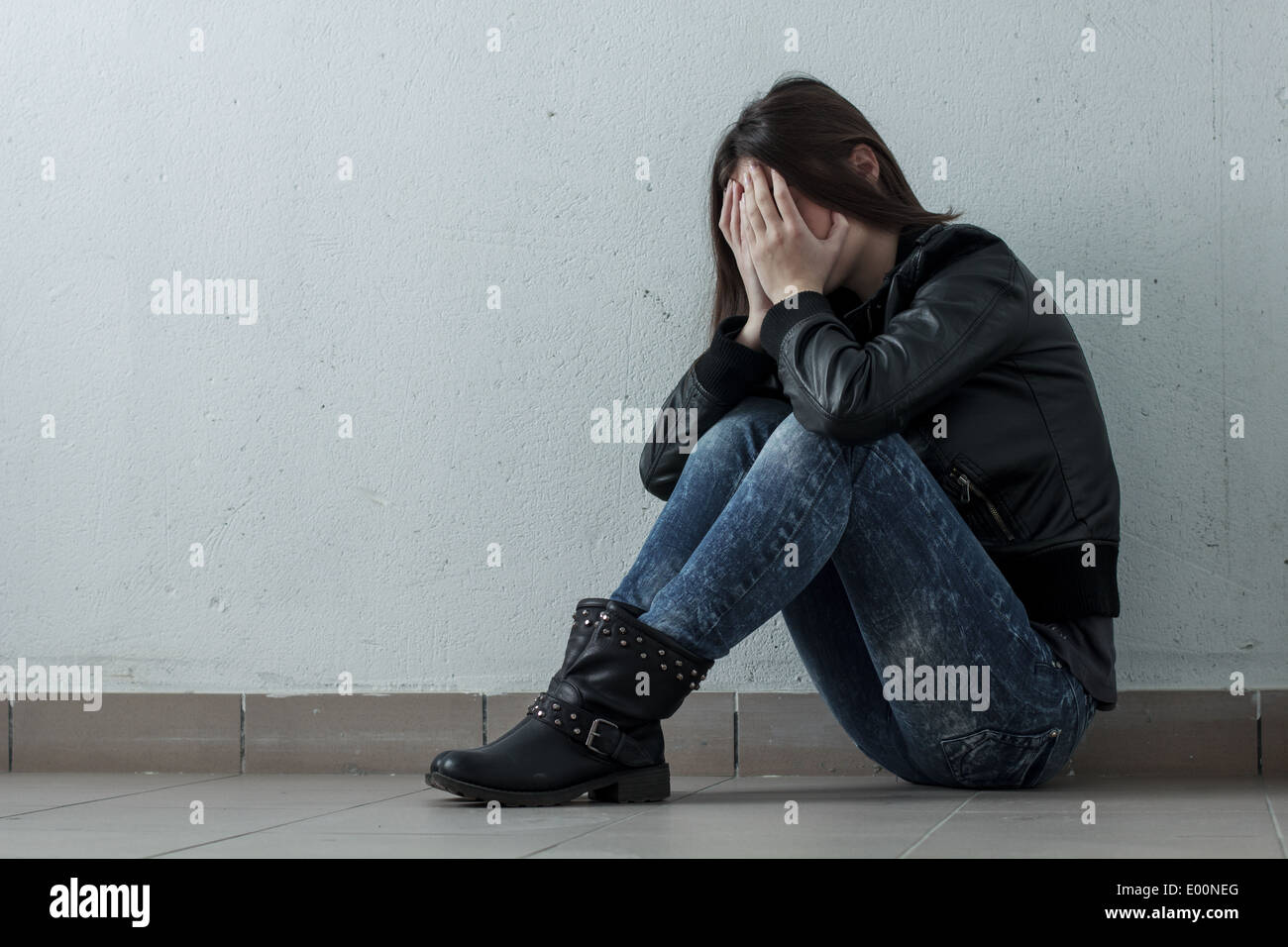 Sad teenage girl with hands over face Stock Photo - Alamy