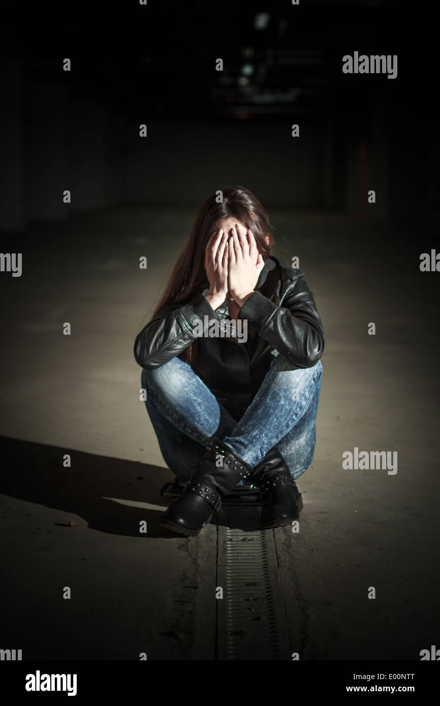 Depressed teenage girl with hands over face Stock Photo - Alamy