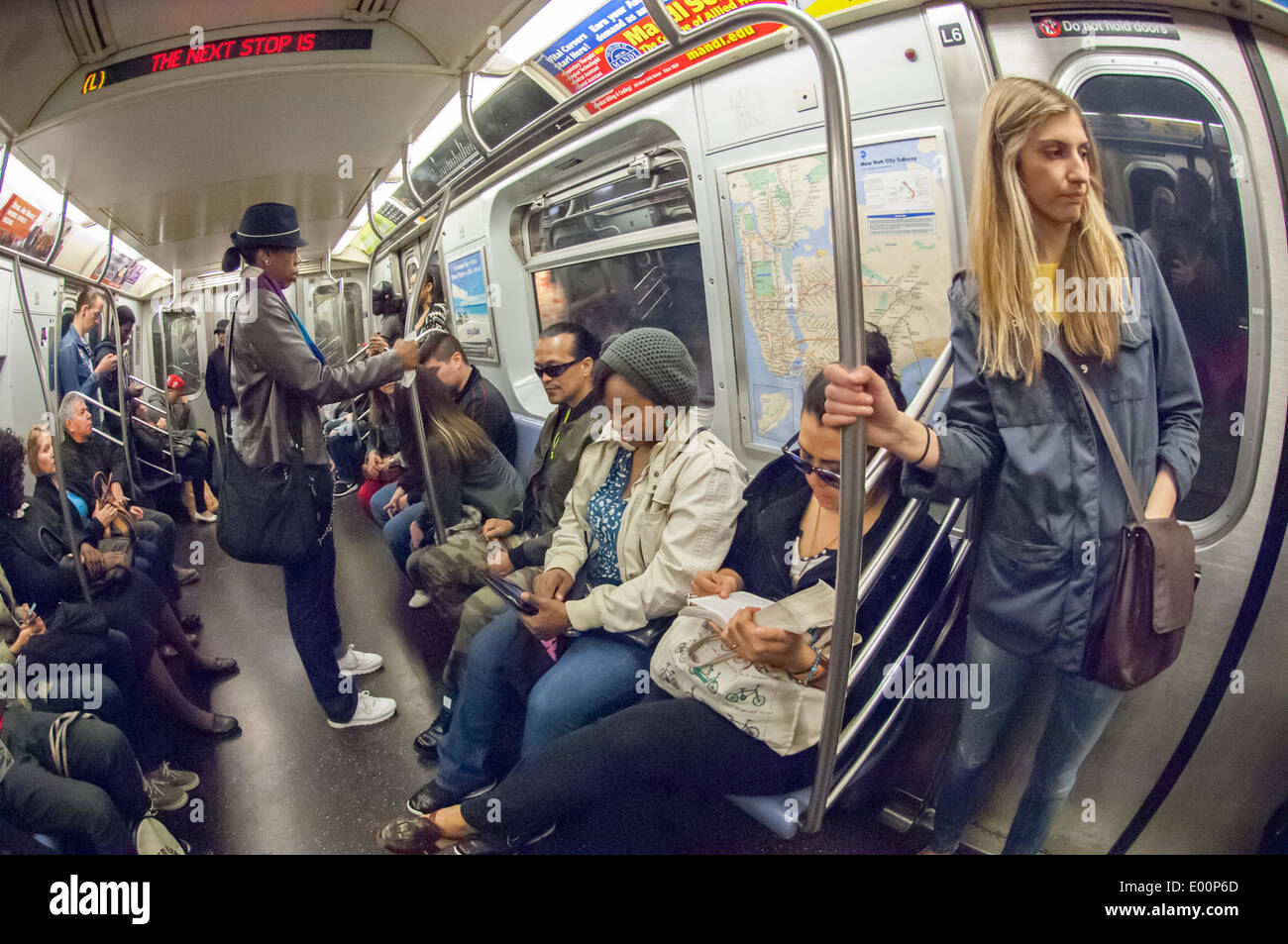 Passengers on the L train subway line in New York on Saturday, April 19 ...