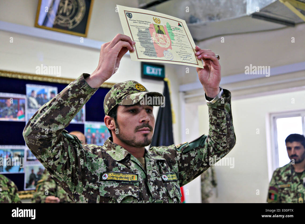 An Afghan National Army soldier of the 203rd Corps raises his ...