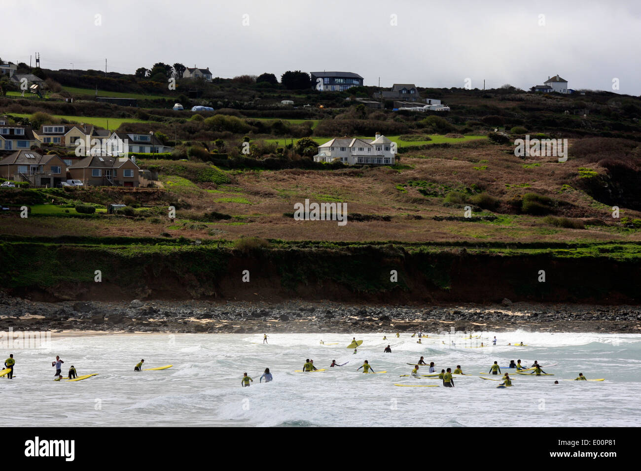 Surfers learning to surf at Porthmeor beach in St Ives in Cornwall ...