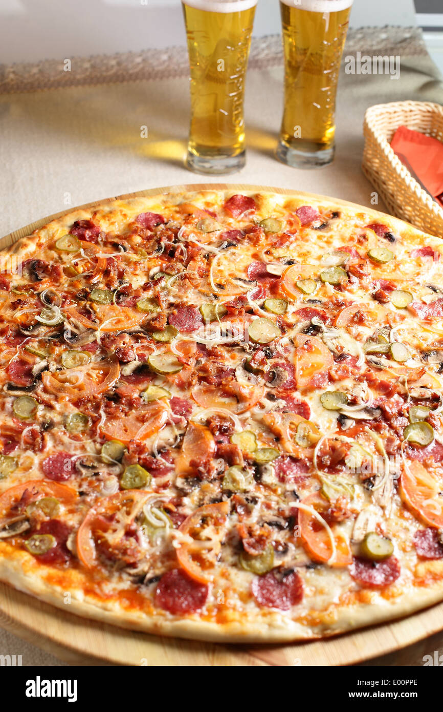 Fresh and hot pizza on the table Stock Photo - Alamy