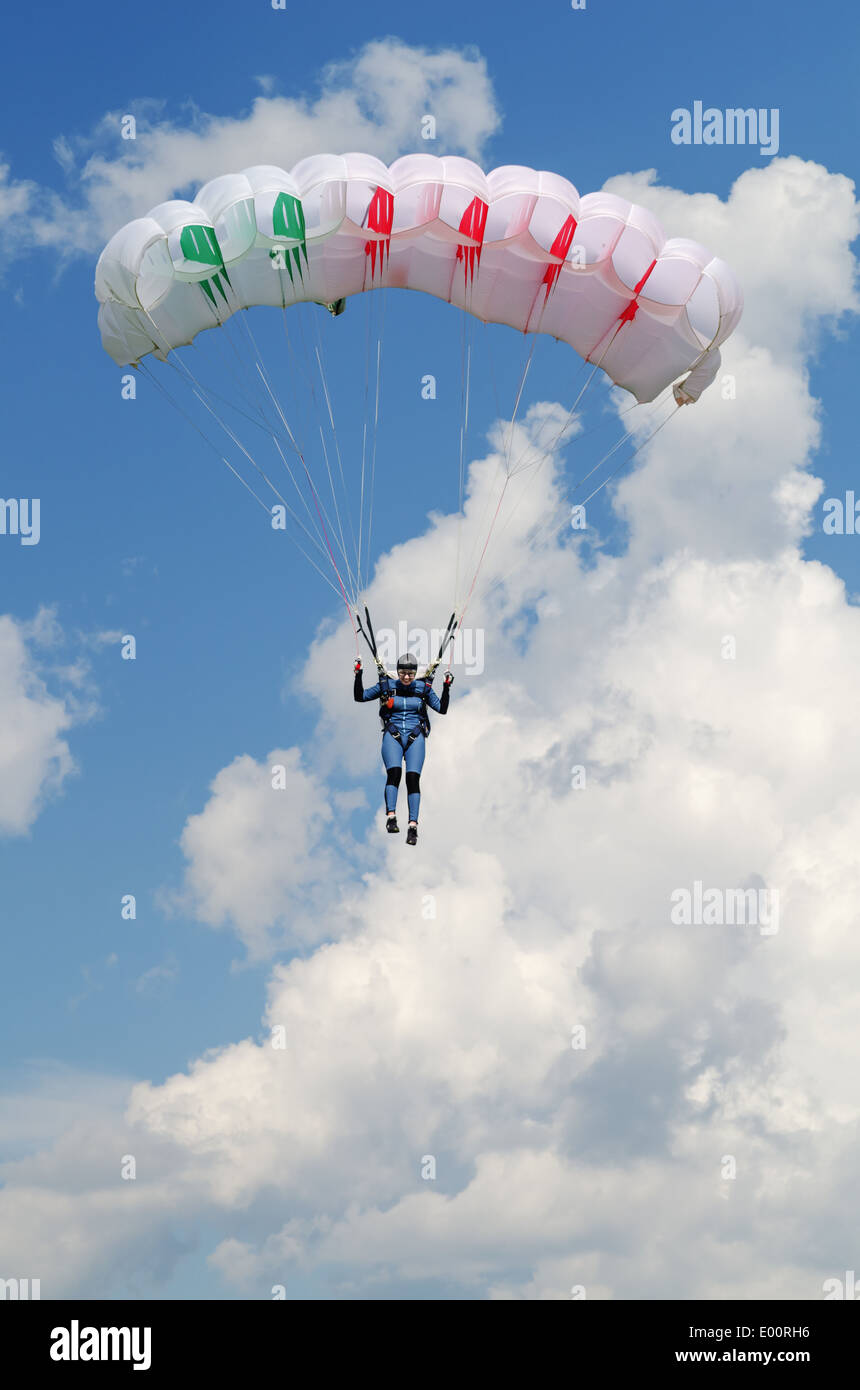 One day with parachutist in airfield. The girl-skydiver lands under the ...