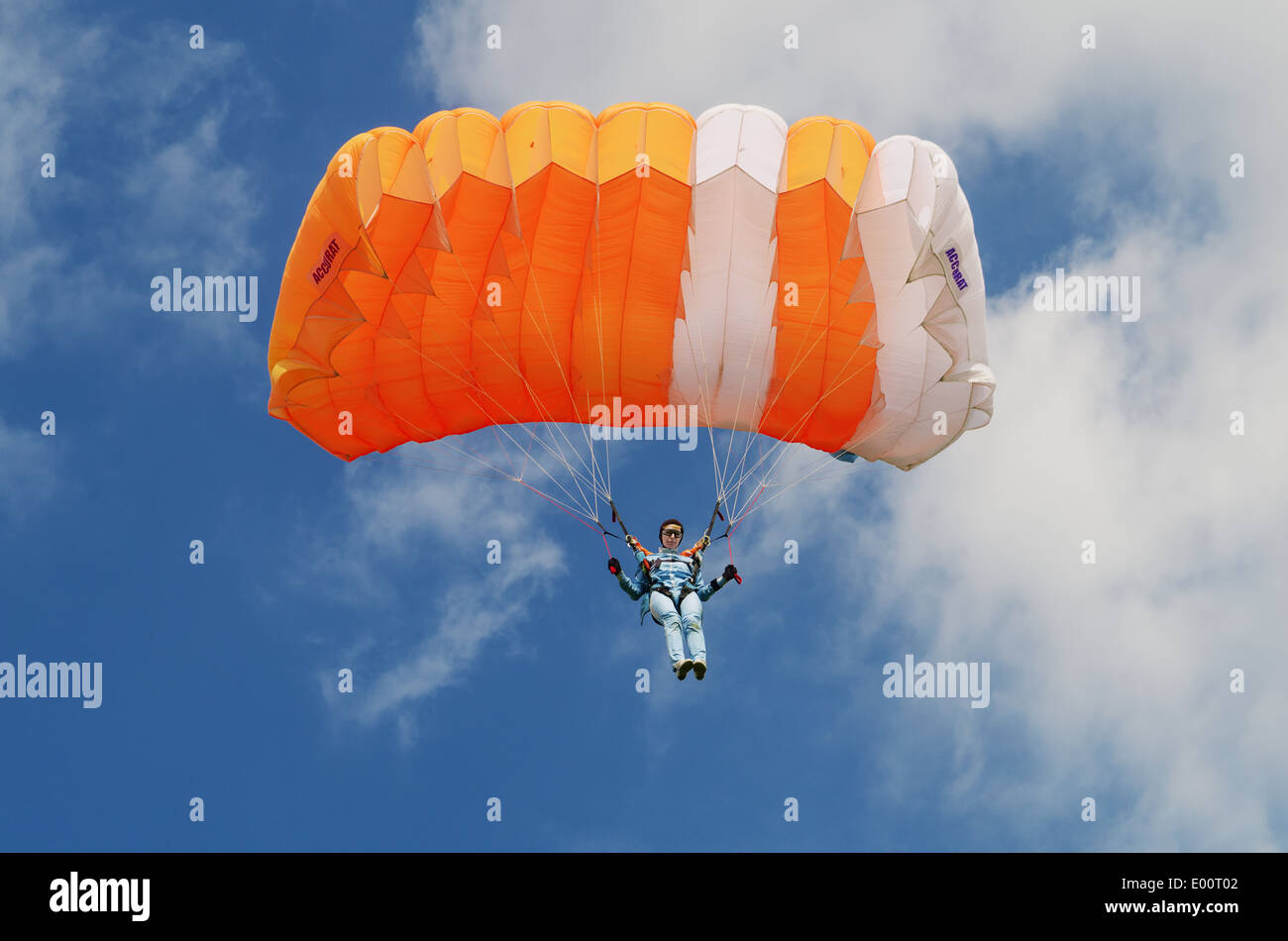 One day with parachutist in airfield. The girl-skydiver lands under the ...
