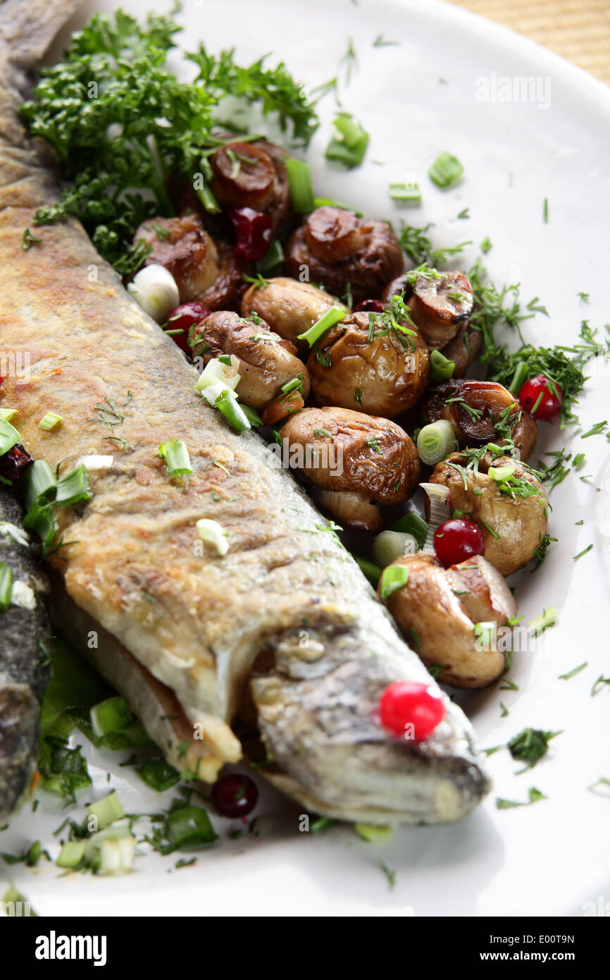 roasted and hot fish mith vegetables and mushrooms Stock Photo - Alamy