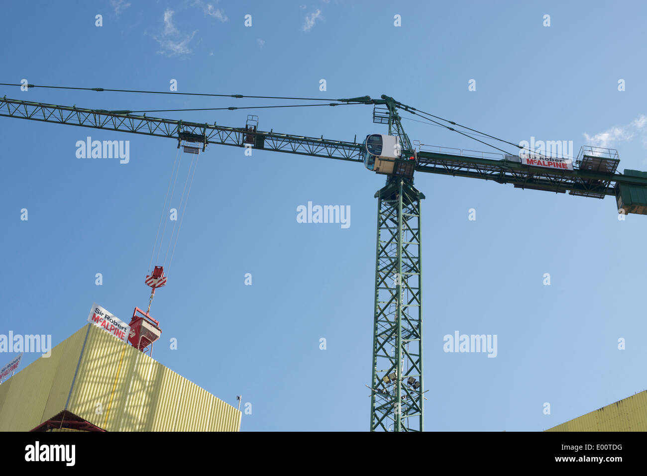 Cranes used for the pouring of concrete during the construction of the ...