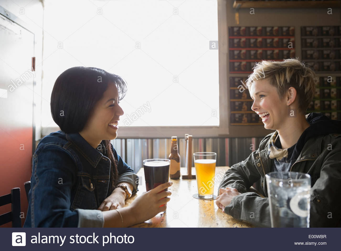 Women bar laughing hi-res stock photography and images - Alamy
