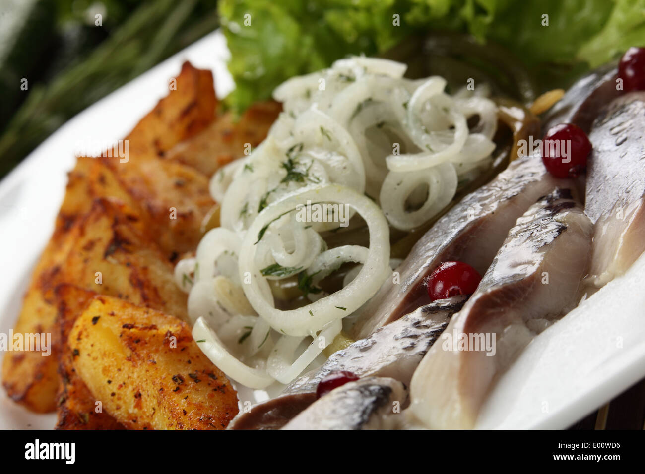 fried potato with fish and fresh vegetables Stock Photo - Alamy