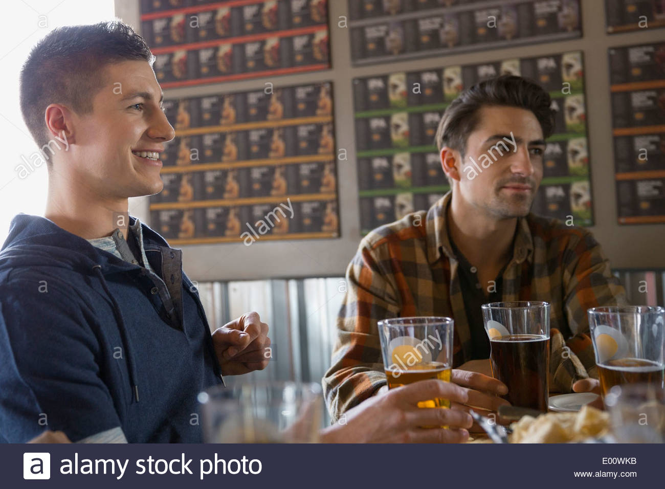 Man Drinking Beer At Bar