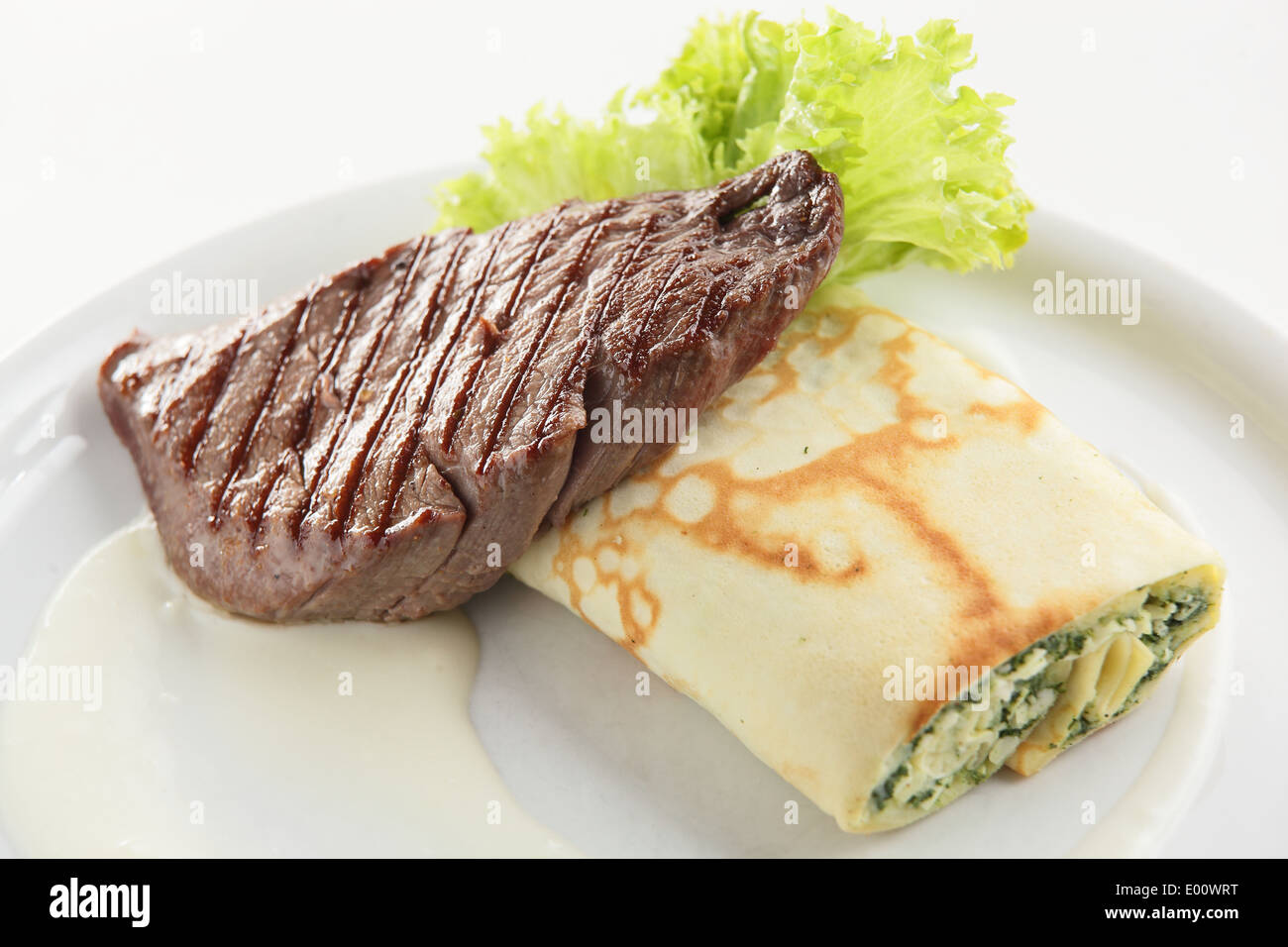 hot and tasty roasted meat on white dish Stock Photo - Alamy